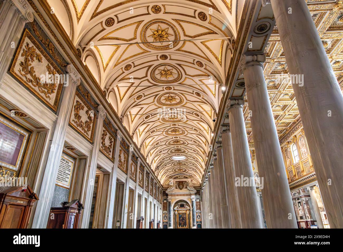 The richly decorated ceiling of one of the side Naves inside Basilica ...