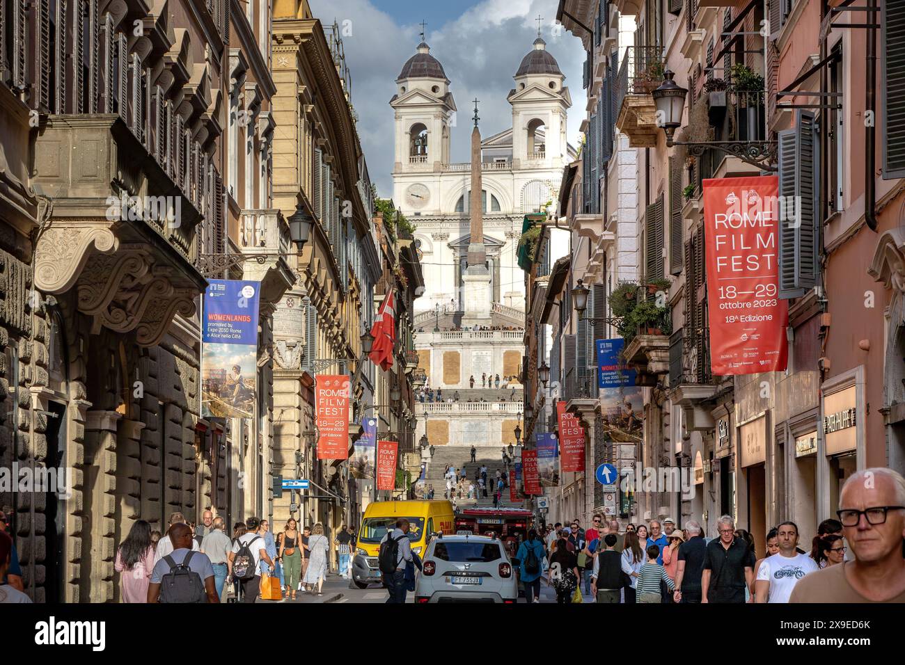 People walking along Via dei Condotti a fashionable street in Rome with ...