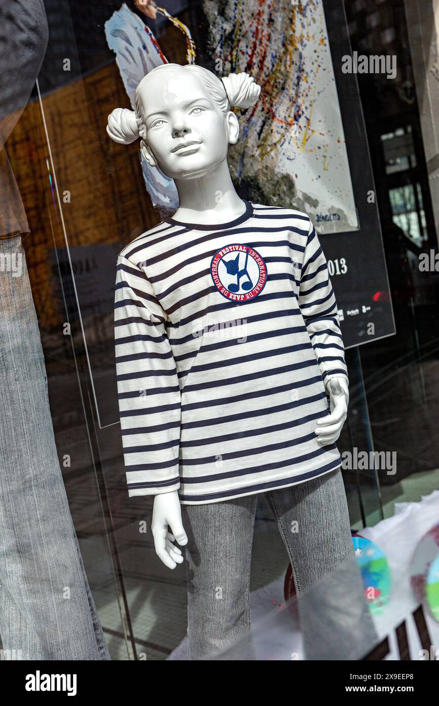 A little girl fashion mannequin in a shop window display Stock Photo ...