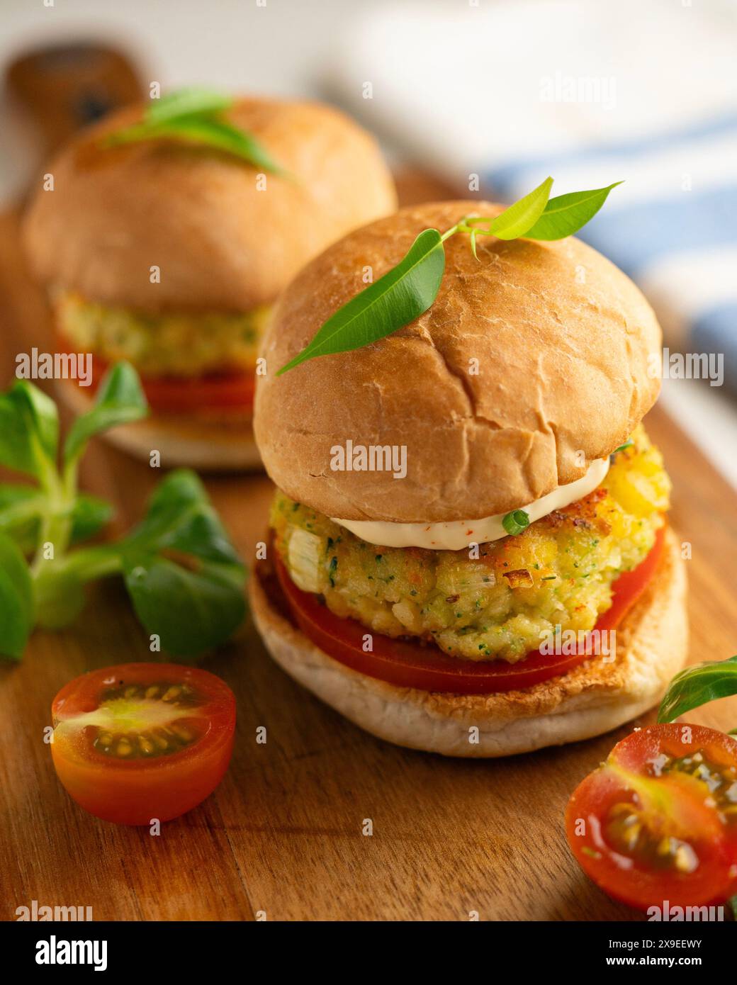 Small fish burgers with vegetables Stock Photo - Alamy