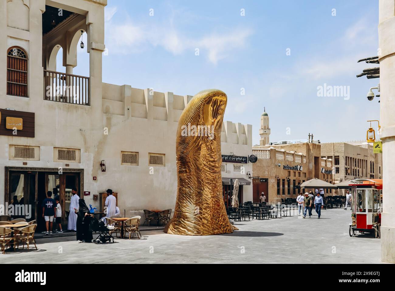 Doha, Qatar - 1 May 2024: The Golden Thumb Statue, an art piece by ...