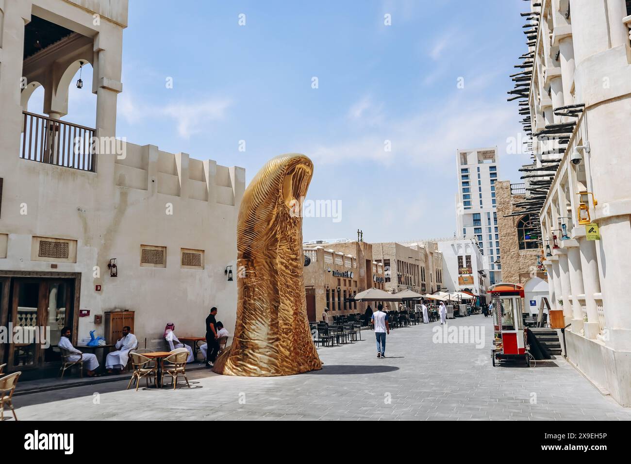Doha, Qatar - 1 May 2024: The Golden Thumb Statue, an art piece by ...