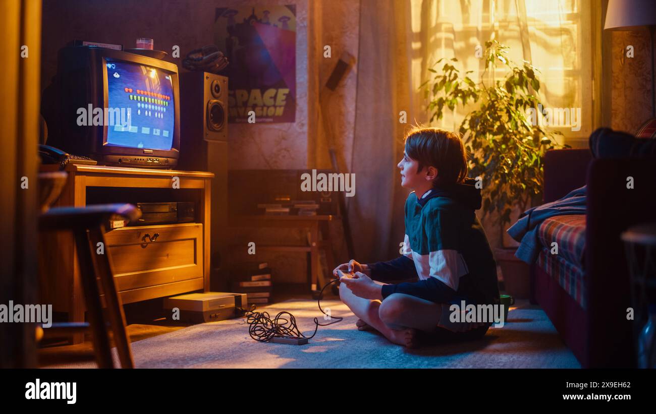 Young Boy Playing Eighties Eight Bit Arcade Space Shooter Video Game on ...