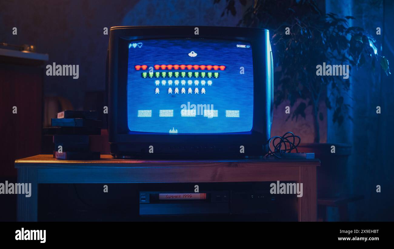 Close Up Footage of a Retro TV Set Screen with an 8 Bit 2D Eighties ...