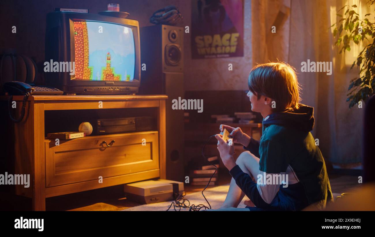 Young Boy Playing Eighties Eight Bit Arcade Video Game on a Console at ...