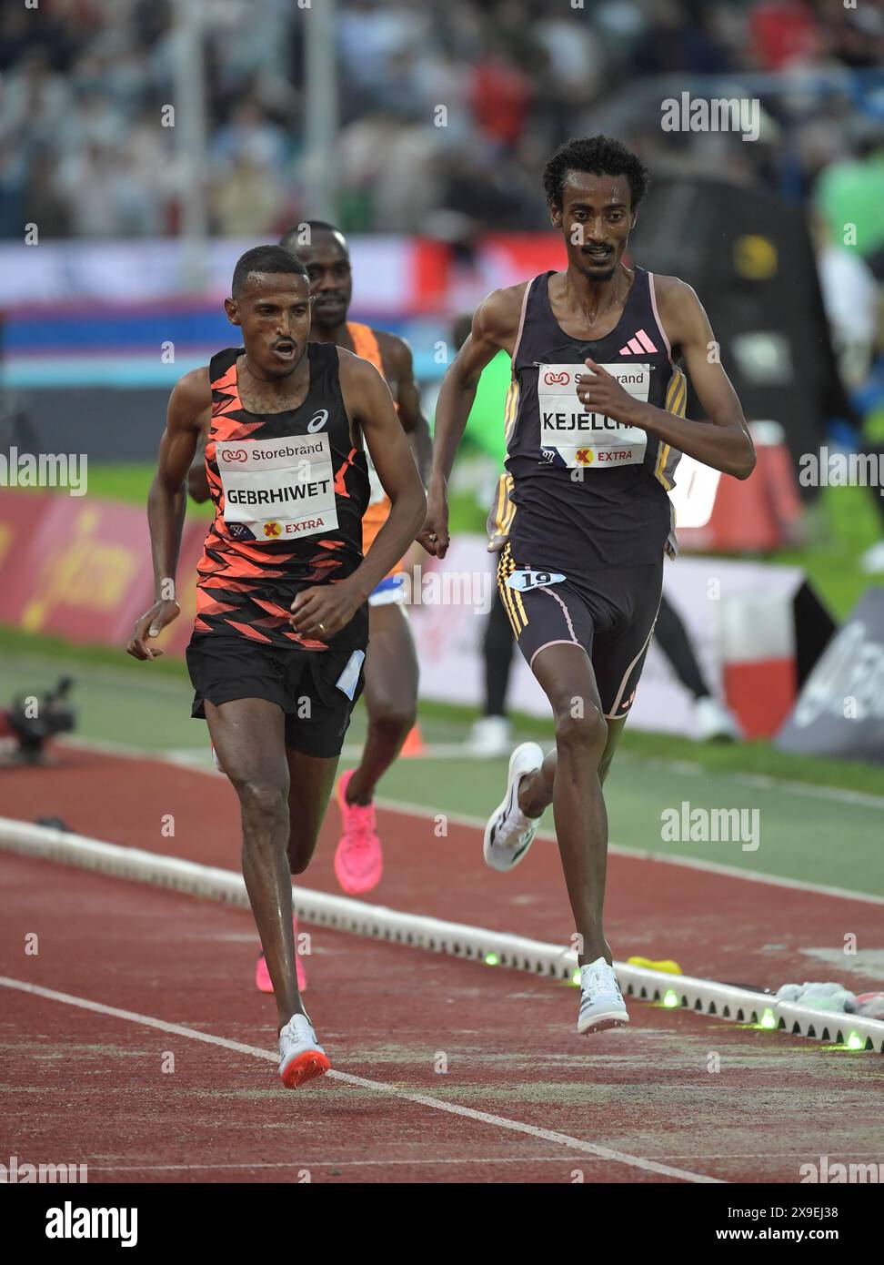 Hagos Gebrhiwet and Yomif Kejelcha of Ethiopia competing in the men’s ...