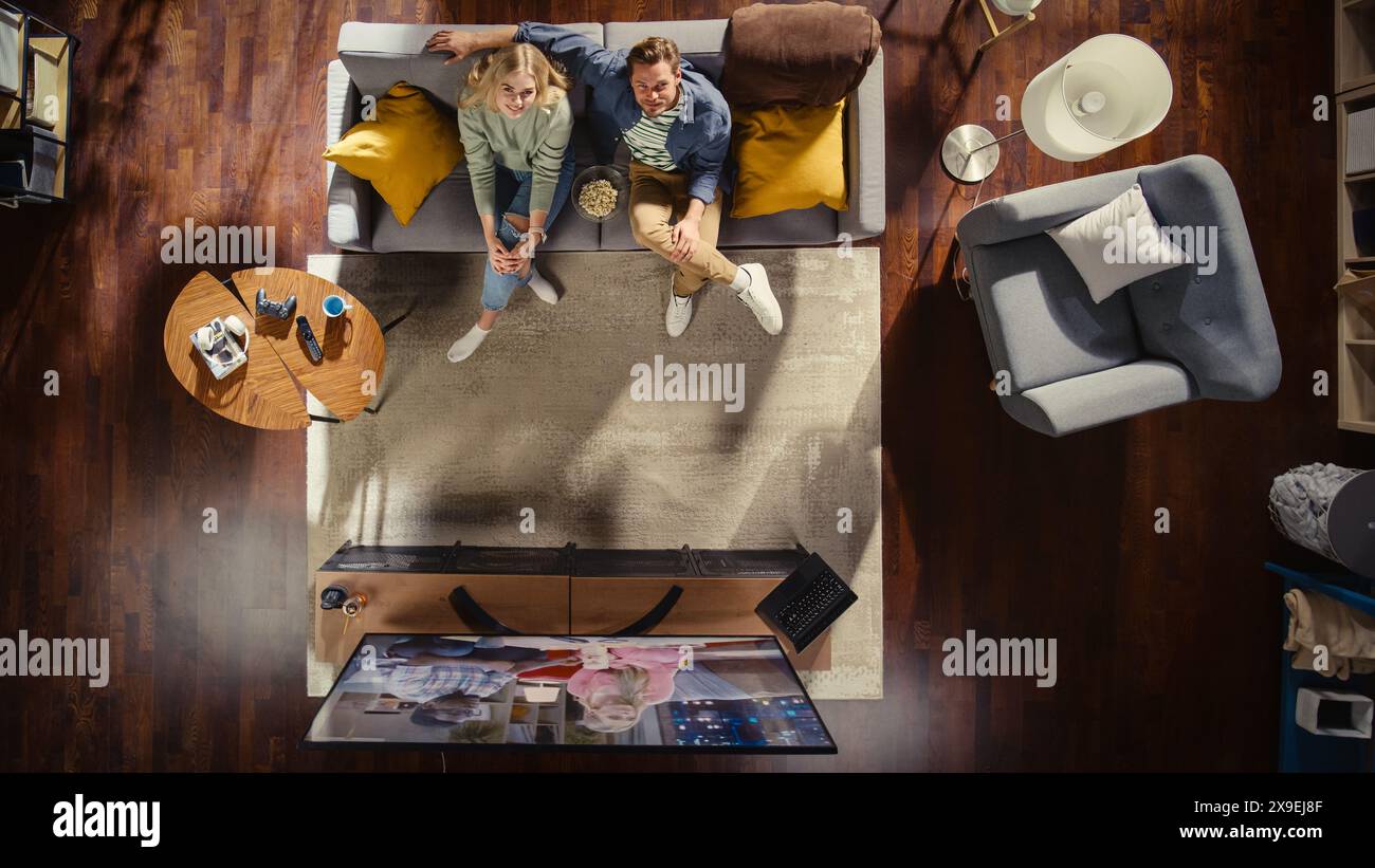 Top View Apartment: Lovely Happy Couple Watching Television in the Loft ...