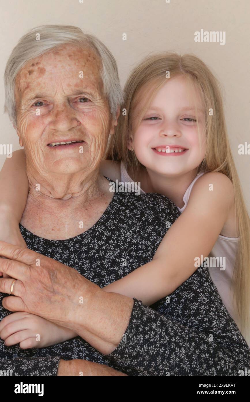 Happy family, child and great grandma hug, relax, smile, love and bond ...