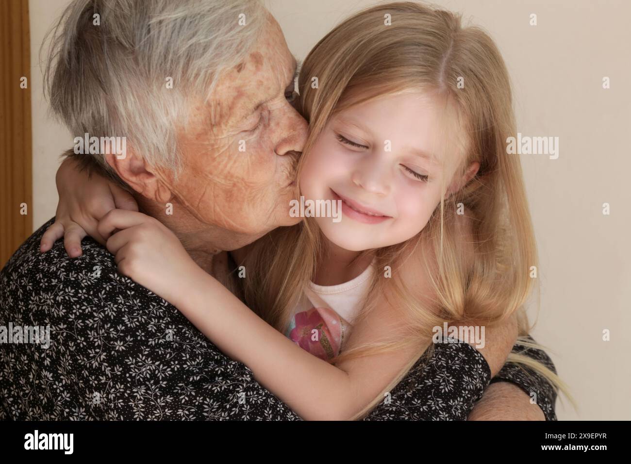 Happy family, child and great grandma hug, relax, smile, love and bond ...