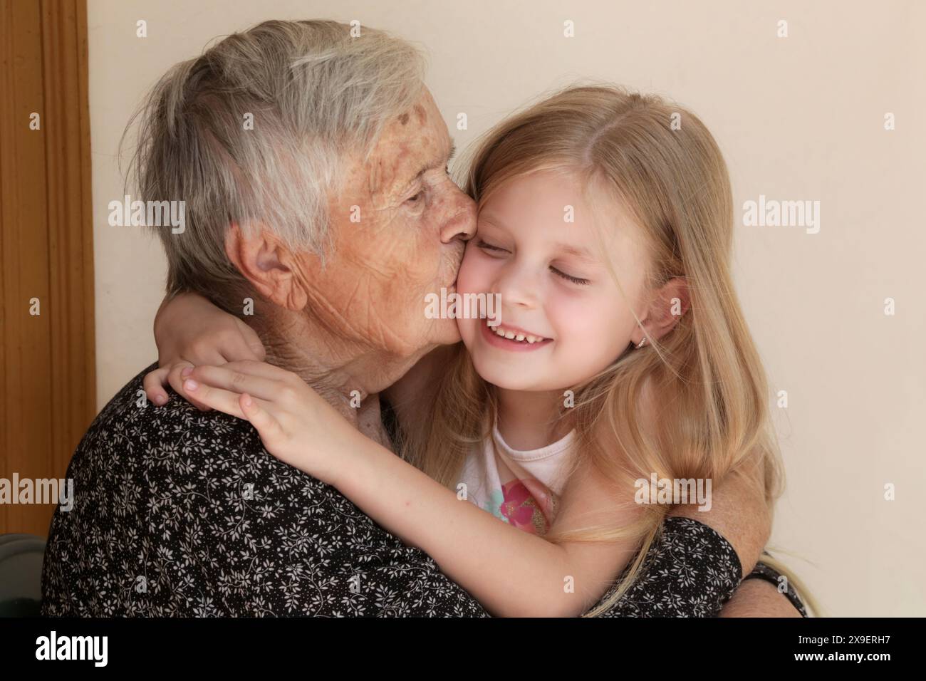 Happy family, child and great grandma hug, relax, smile, love and bond ...