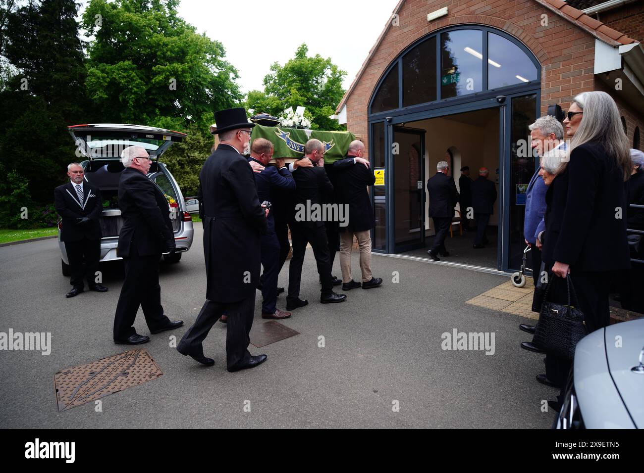 The coffin of D-Day veteran Albert Price, 98, from Solihull, is carried ...