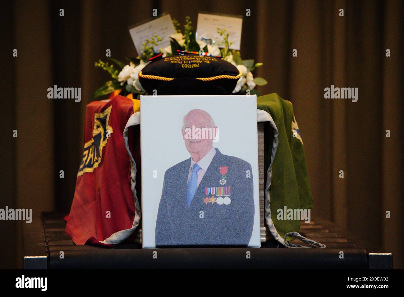 A portrait beside the coffin of D-Day veteran Albert Price, 98, from ...