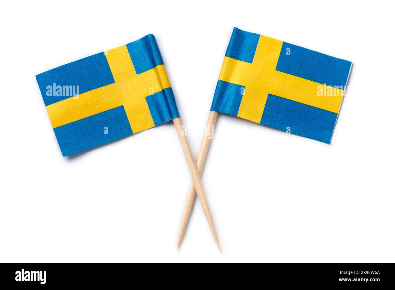 Miniature Swedish paper flags close up isolated on white background ...