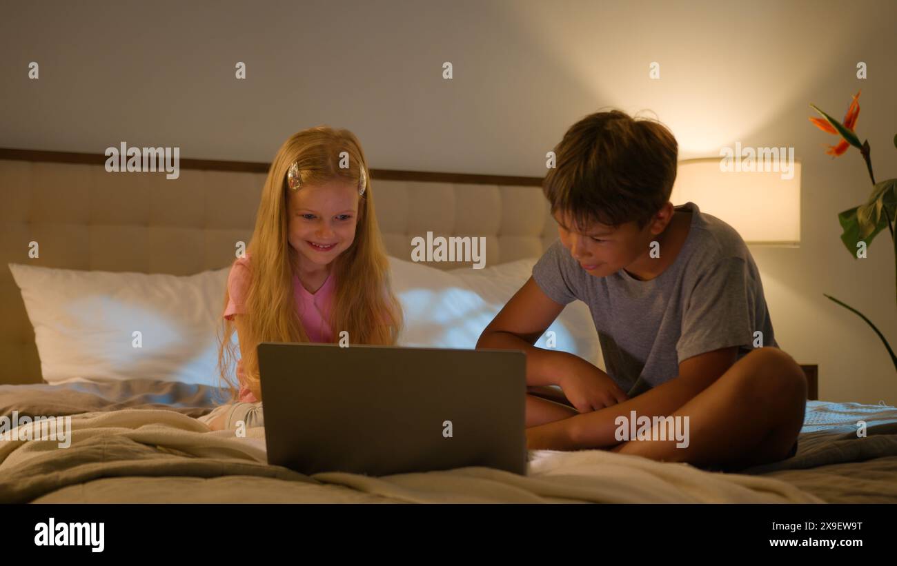 Happy family Caucasian children daughter son little kids watching movie ...