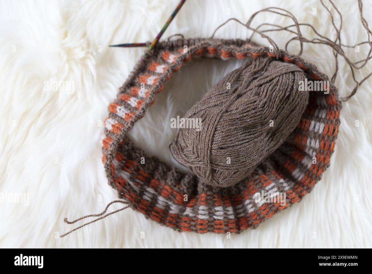 Flat lay photography of Fair Isle knitting in progress with brown ...