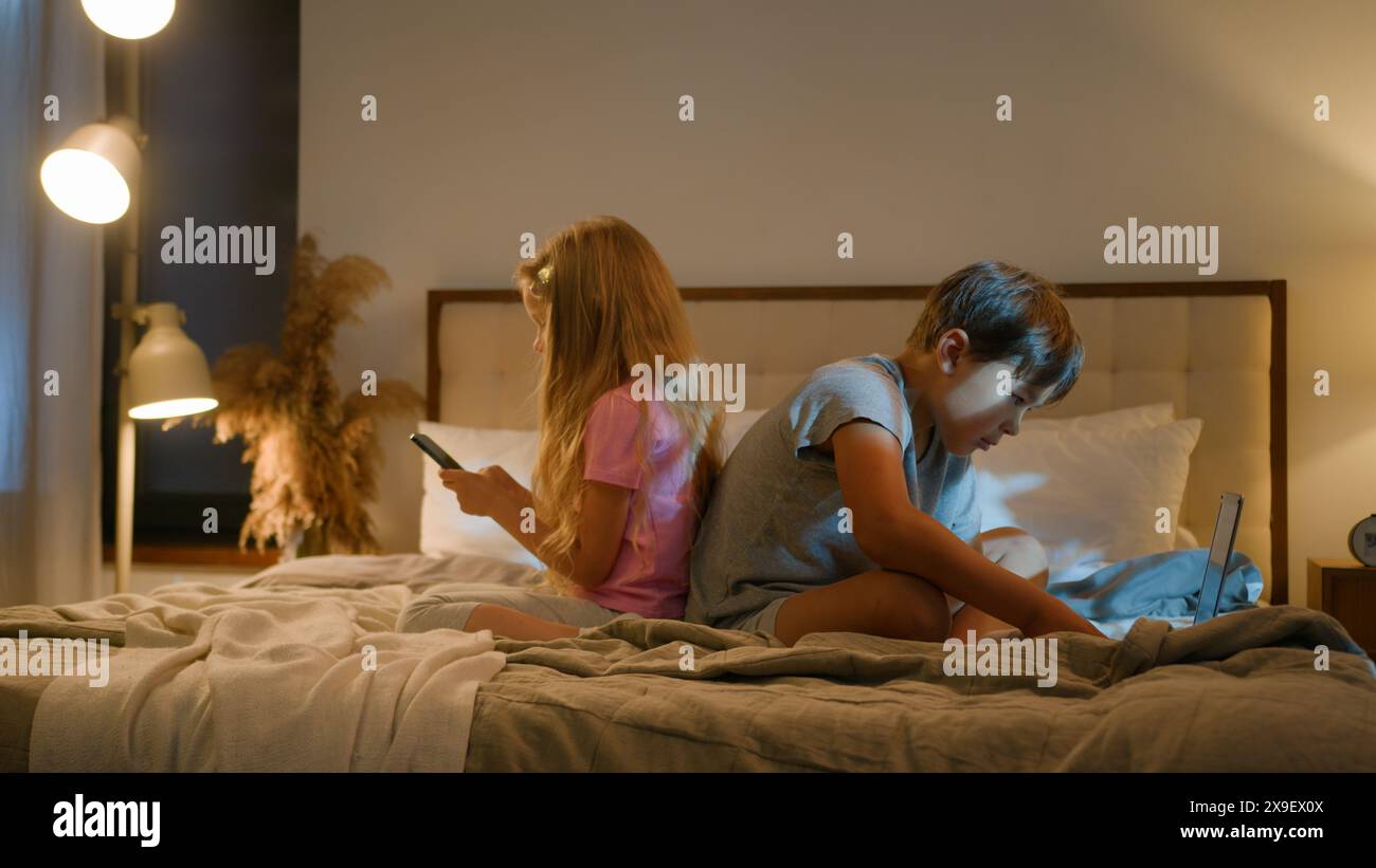 Gadget addiction. Caucasian family little children girl daughter using ...