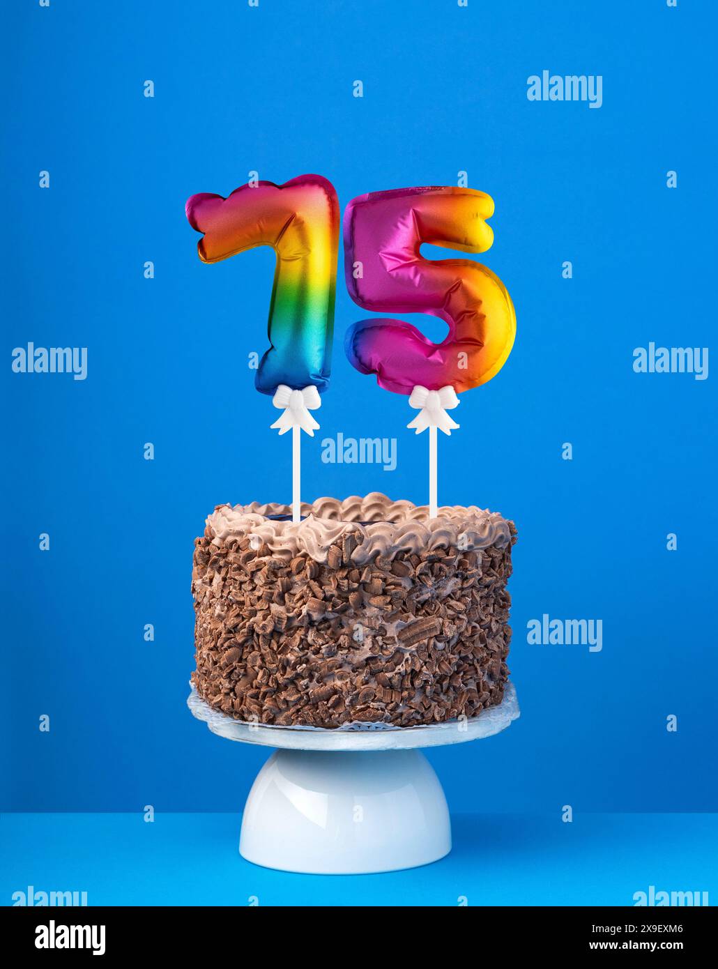 Air balloon number 75 - Birthday cake on blue background Stock Photo ...