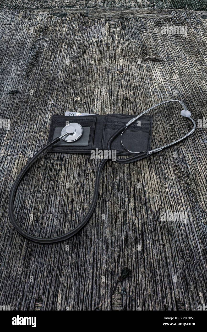 Minimalist still life of an almost empty leather wallet on a dark ...