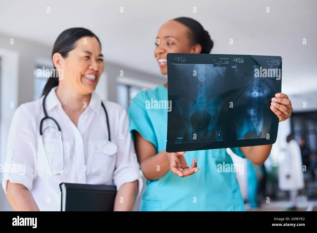 Diverse Medical Team Reviewing X-Ray Results in a Hospital Setting ...