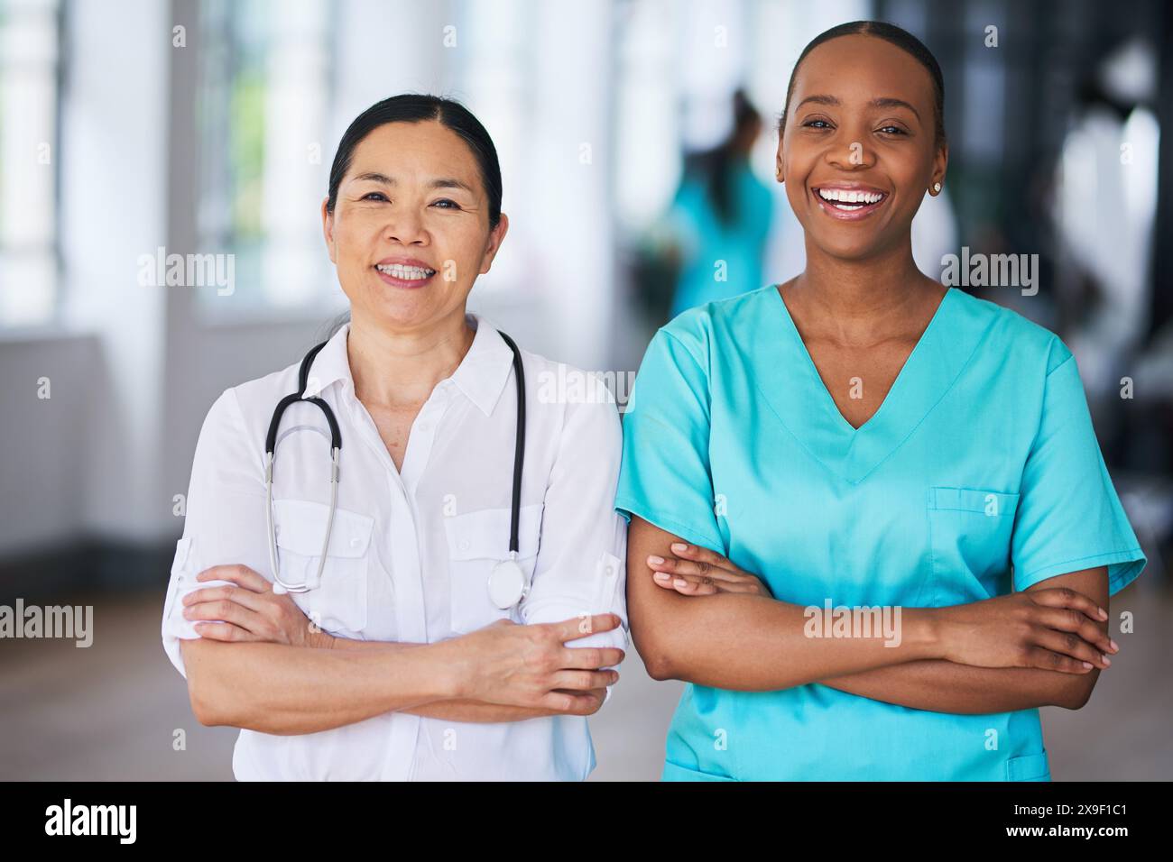 Diverse Medical Team Smiling in Hospital Environment Stock Photo - Alamy