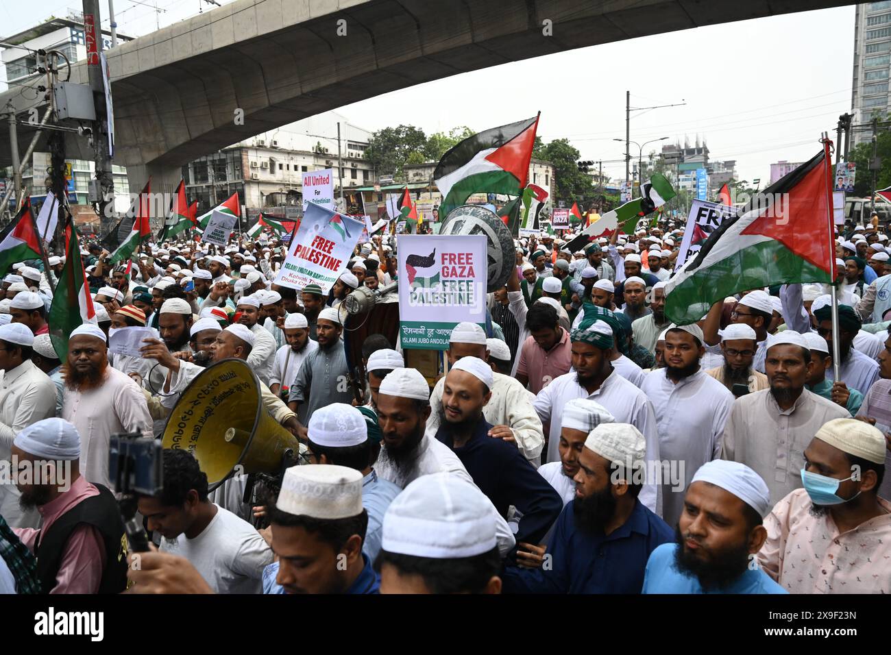 Activists of Islami Andolan Bangladesh staged a mass procession demanding stop genocide and free ...