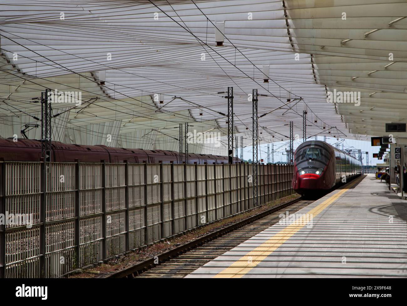 High-speed train enters Reggio Emilia AV Mediopadana Station, advanced ...