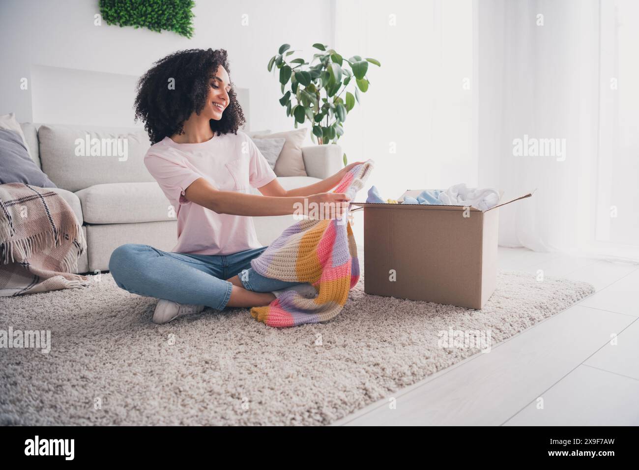 Photo of lovely dreamy cute girl wear trendy clothes sit floor unpack ...