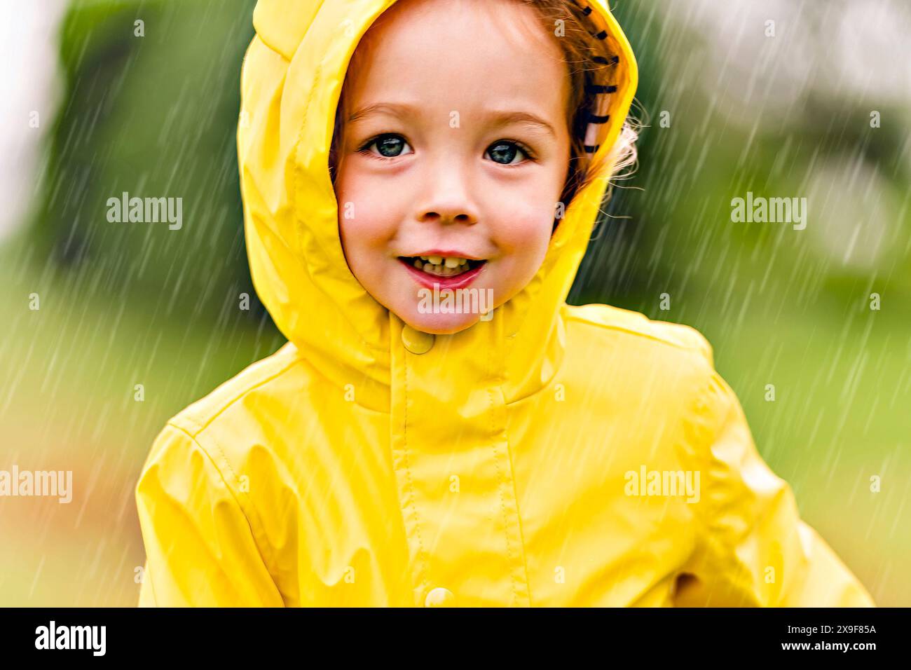 Happy funny child with raincoat under the summer raining day Stock ...