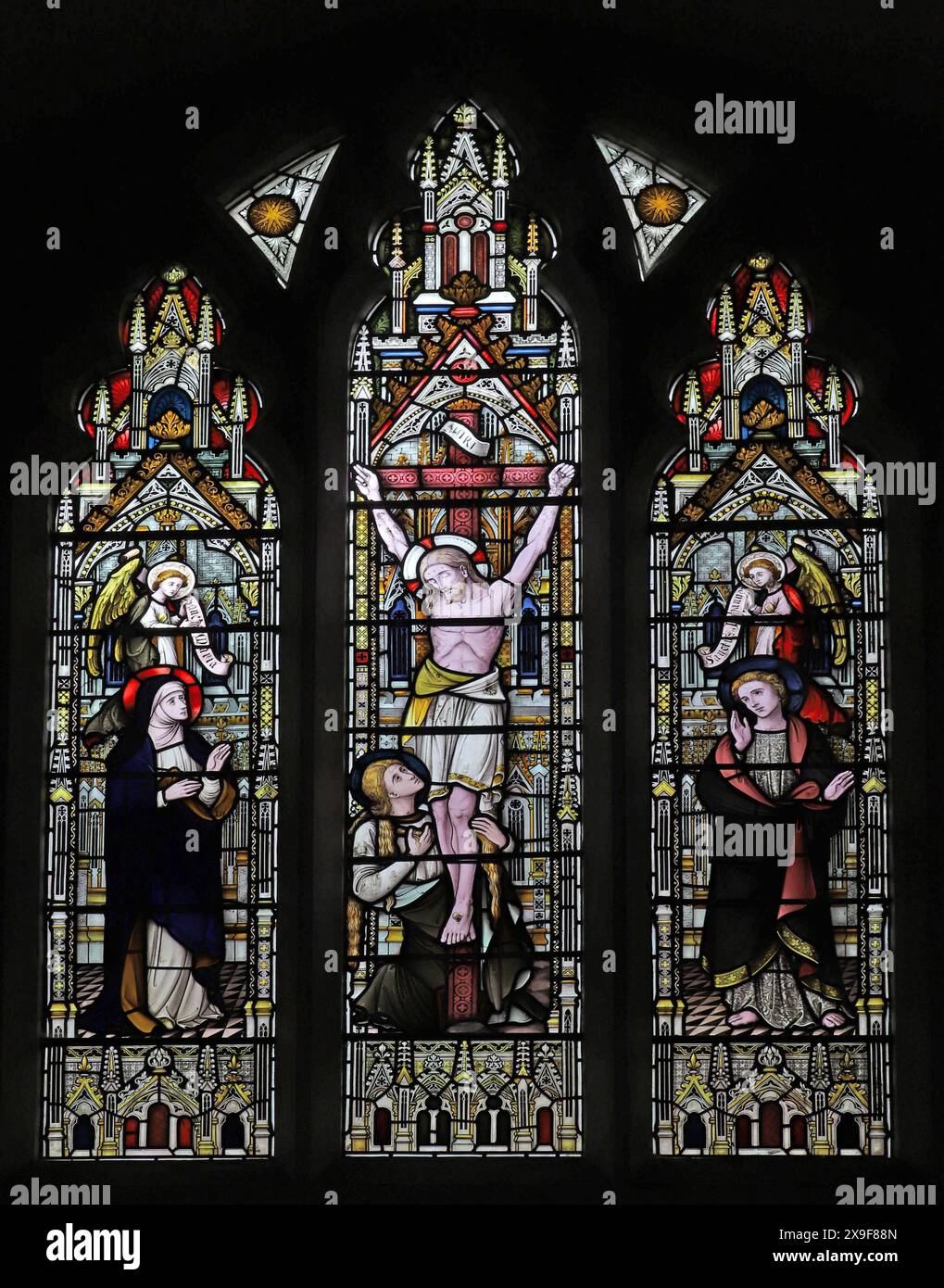 A stained glass window by Lavers, Barraud & Westlake depicting the Crucifixion of Jesus, Holy ...