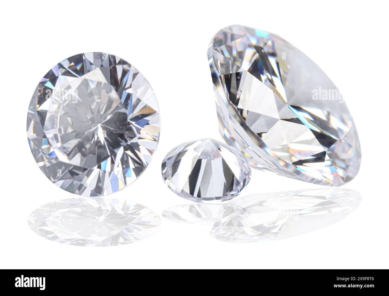 Three beautiful dazzling diamonds on white background Stock Photo - Alamy