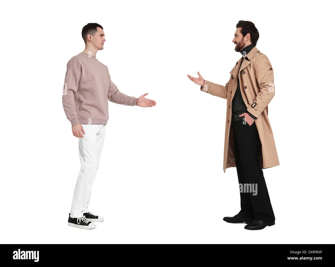 Two men talking on white background. Dialogue Stock Photo - Alamy