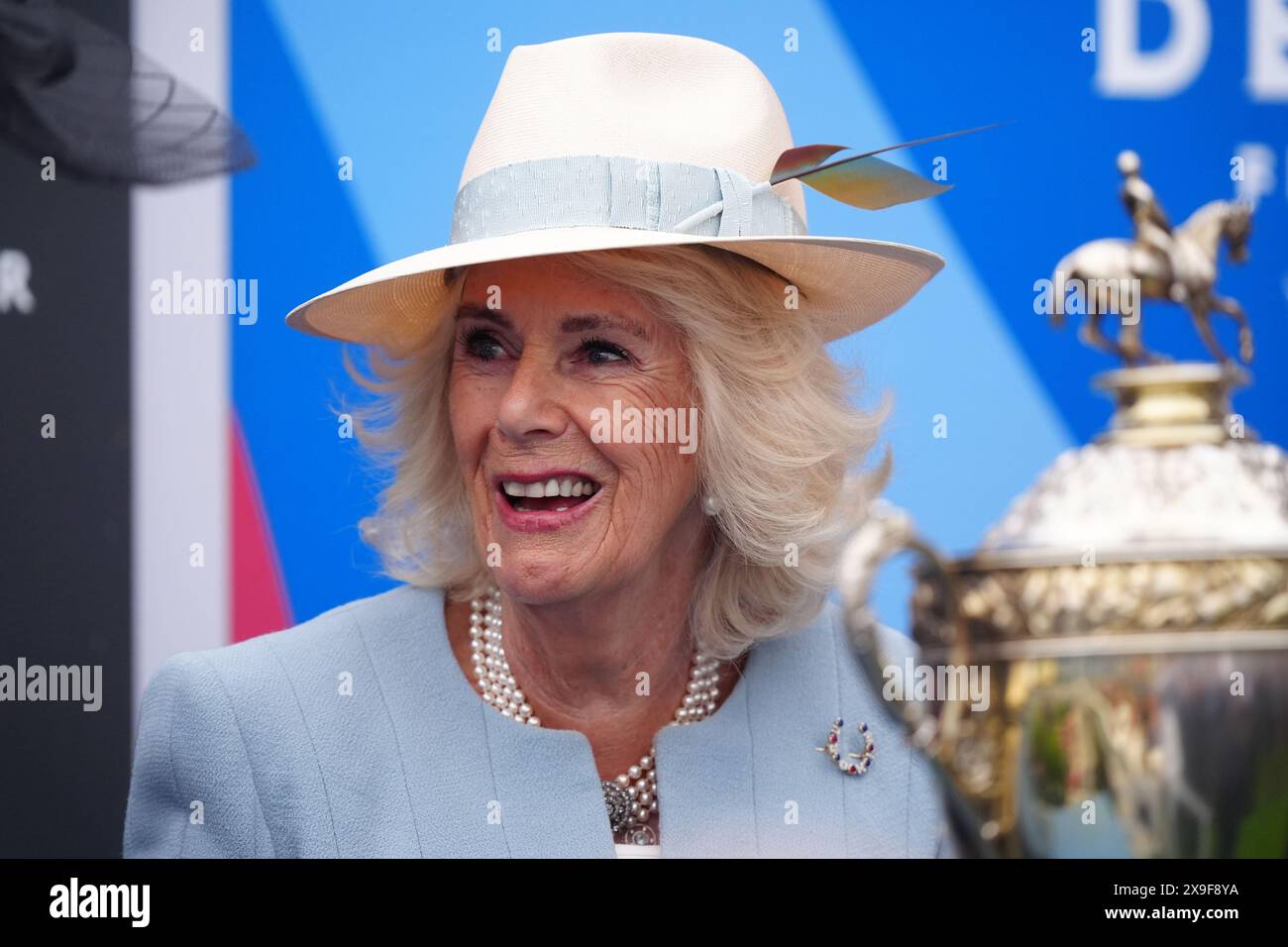 Queen Camilla presents the trophy for the Holland Cooper Coronation Cup ...