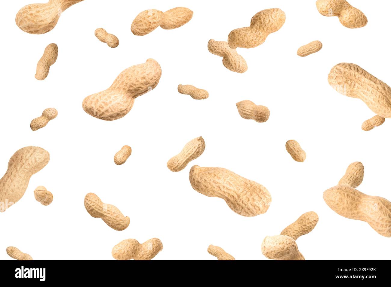 Unpeeled peanuts in air on white background Stock Photo - Alamy