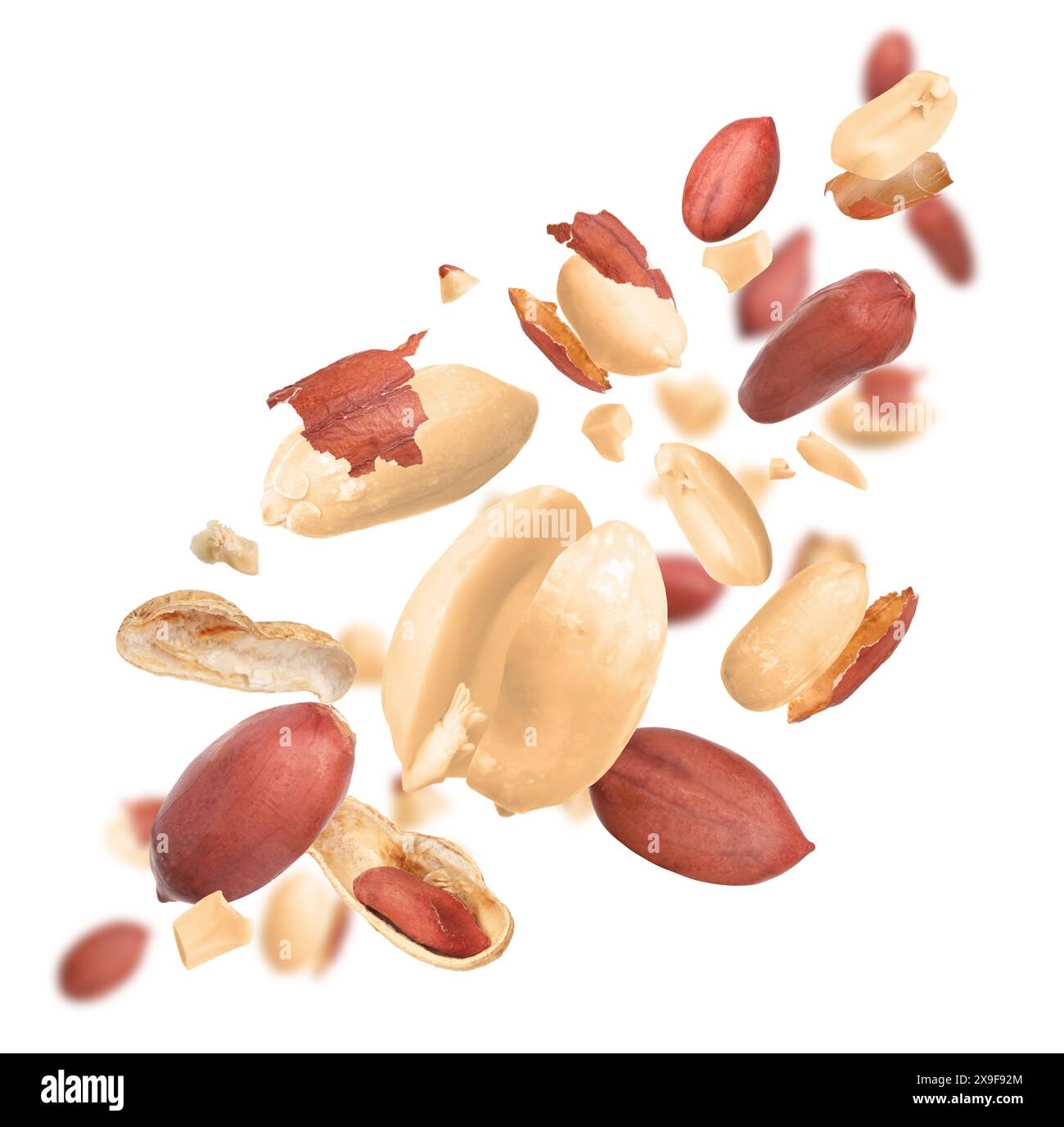 Unpeeled peanuts in air on white background Stock Photo - Alamy