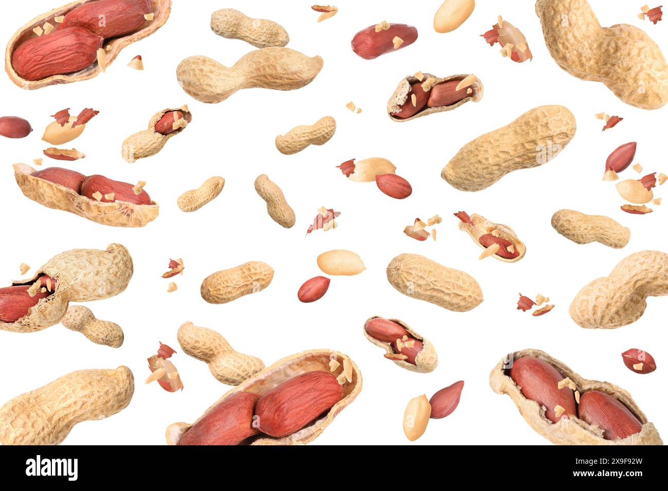 Unpeeled peanuts in air on white background Stock Photo - Alamy