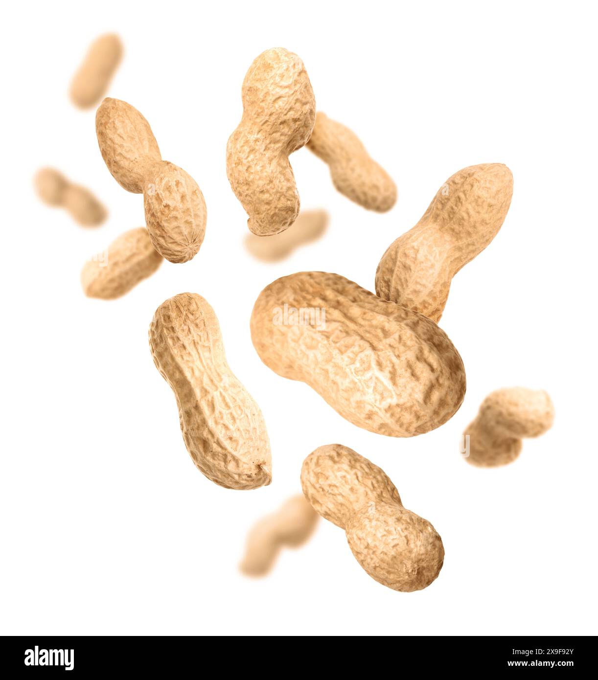 Unpeeled peanuts in air on white background Stock Photo - Alamy