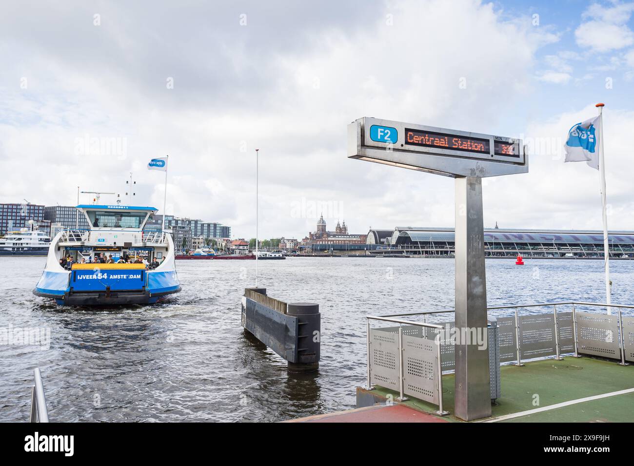 A local passenger ferry arrives into the IJplein ferry terminal having ...