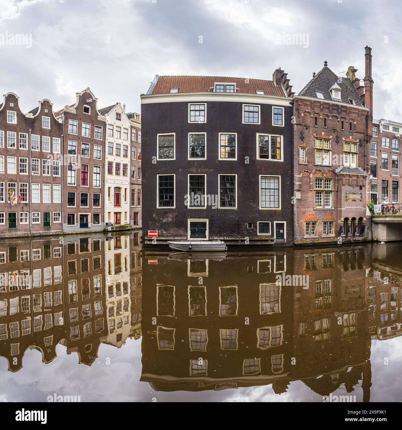 View next to Armbrug Bridge as the canal houses meet the waters edge in ...