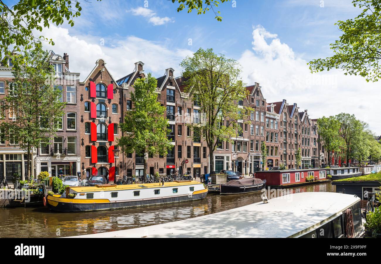 Pretty town houses featuring colourful shutters line the Prinsengracht ...