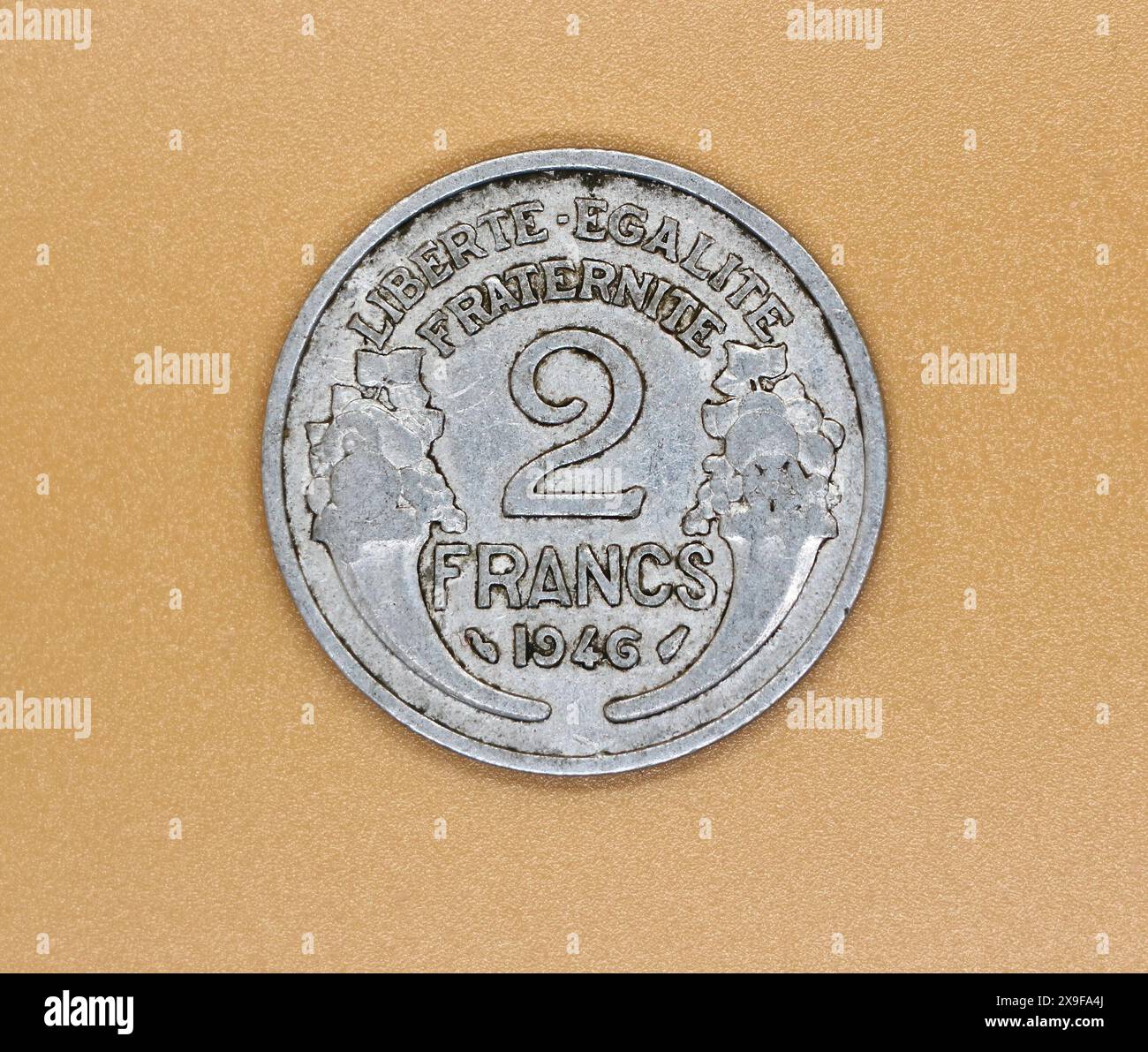 Photo close up of the reverse of a used and dirty 1946 French 2 francs ...
