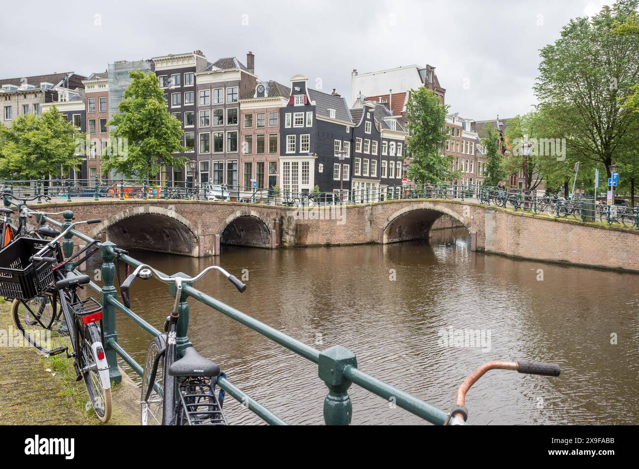 Arches of bridges where the Reguliersgracht canal meets the ...