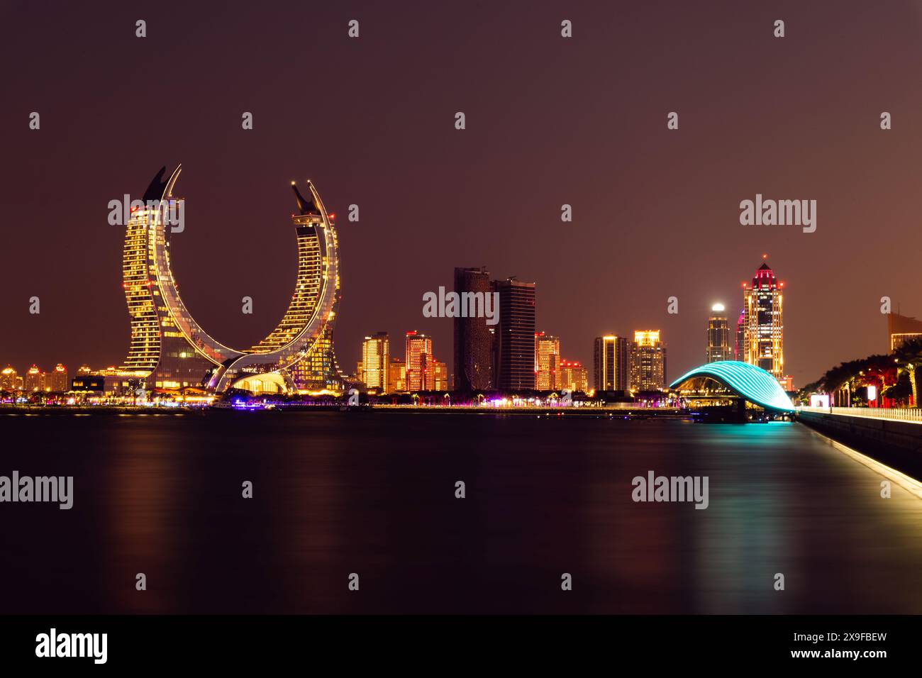 Illuminated waterfront cityscape at night, Lusail Marina, Qatar Stock ...
