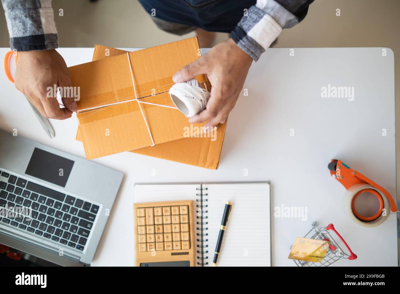 SME entrepreneurs prepare packages and verify customer information ...