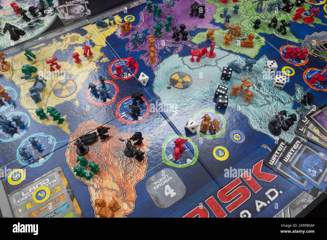Closeup to a risk 2210 board game with triangular and cube dice with ...