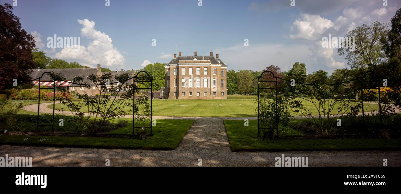 Wide angle banner panorama of castle gardens in full sunlight greenery ...