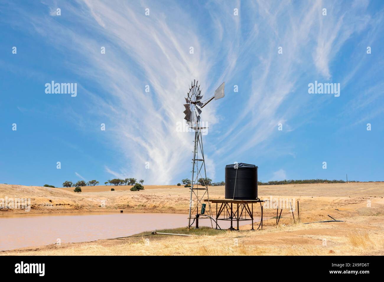 Old metal windmill in rural outback landscape, Western Australia ...