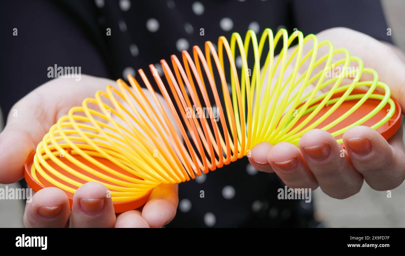 close up of colorful rainbow toy in hands Stock Photo - Alamy