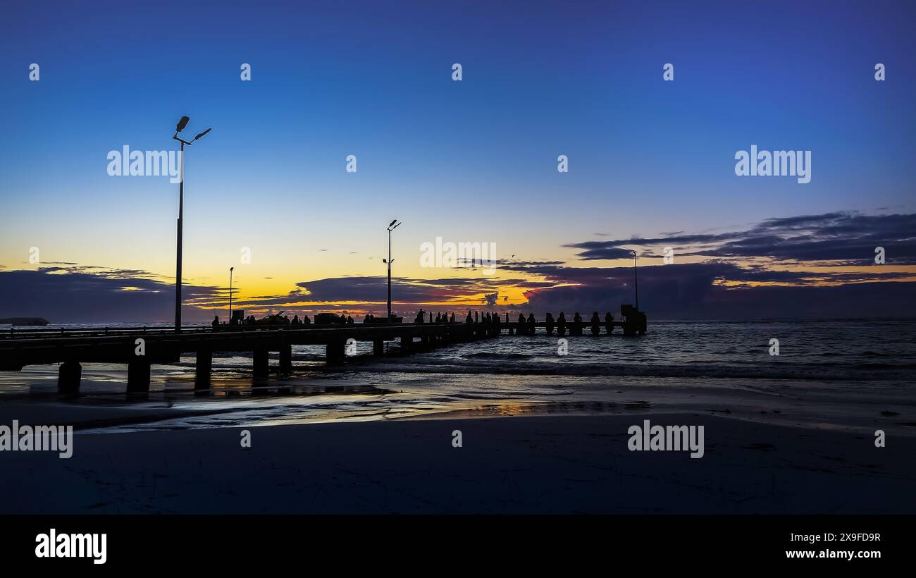Silhouette of a jetty at sunset, Lancelin, Western Australia, Australia ...