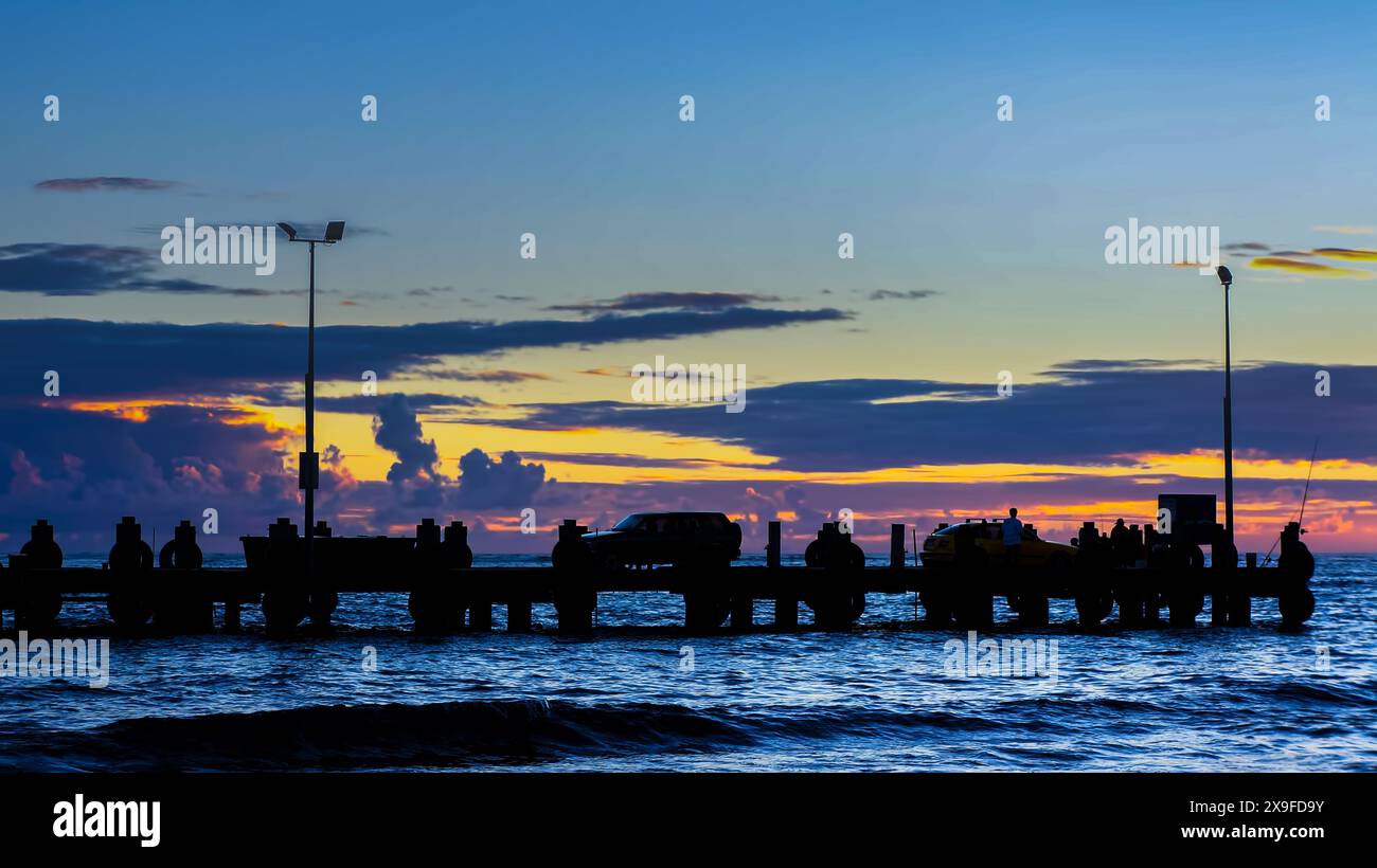 Silhouette of a jetty at sunset, Lancelin, Western Australia, Australia ...