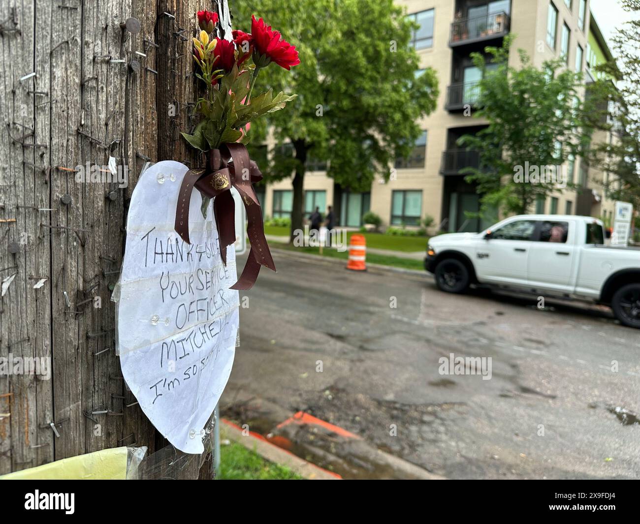 A small tribute marked the scene of a shooting the day prior where at ...